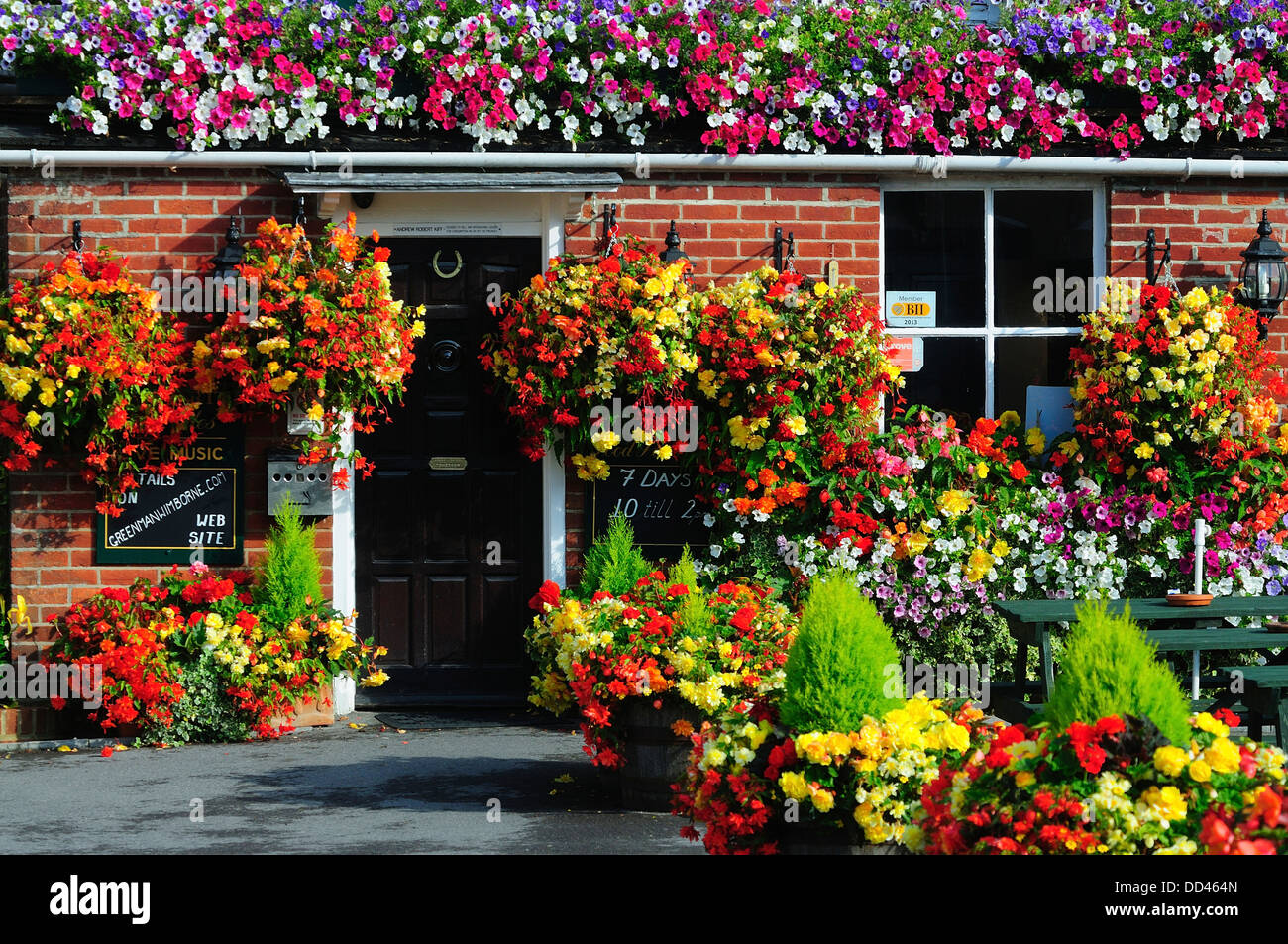 Hanging flower baskets outside house hi-res stock photography and ...