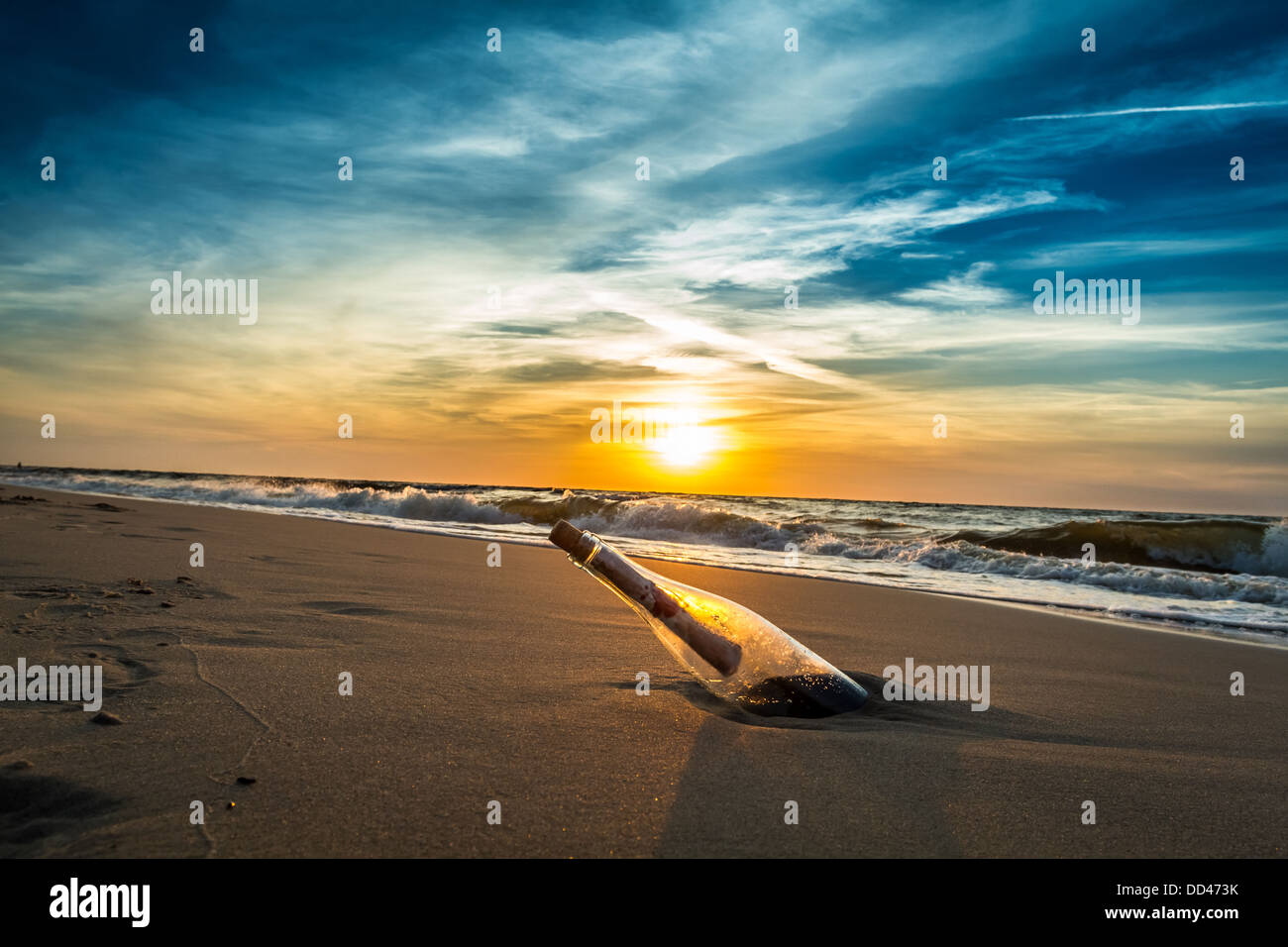 SOS message in a bottle on the beach Stock Photo - Alamy