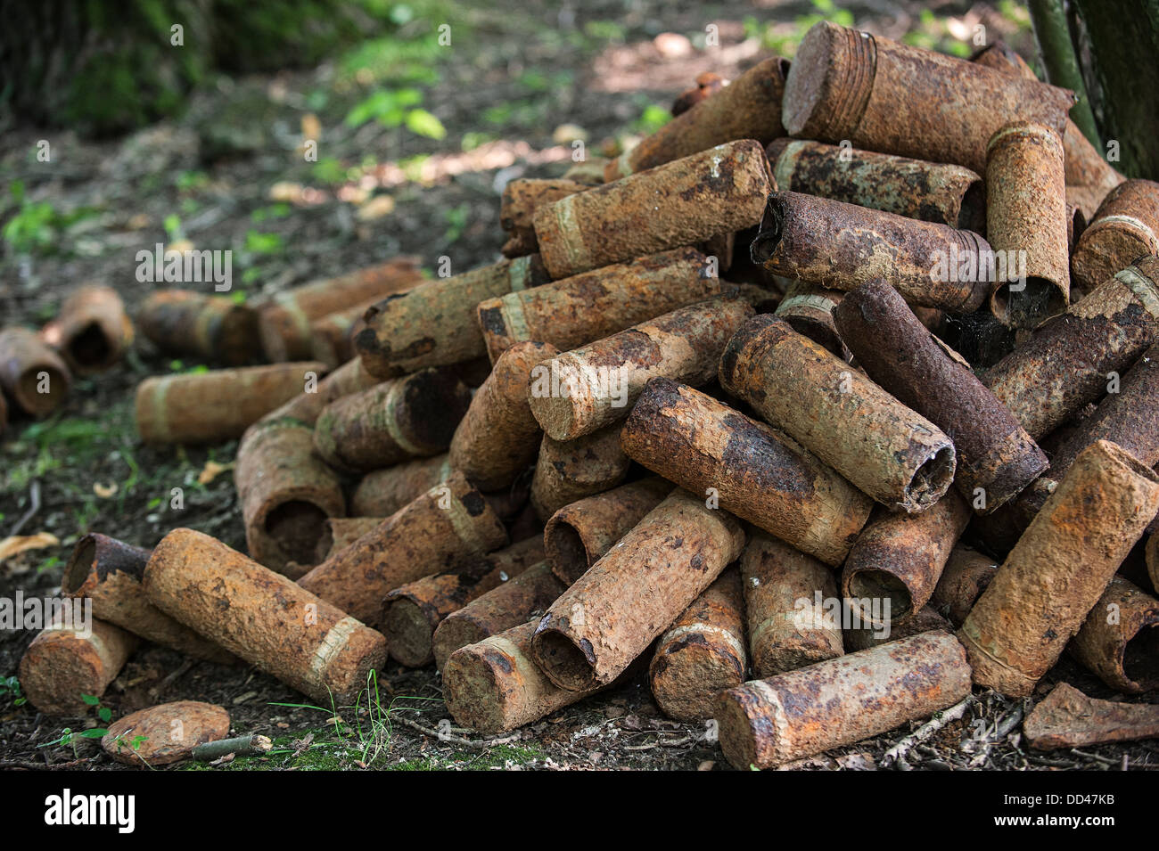 Pile of rusty First World War One artillery grenade shells, dug up in ...