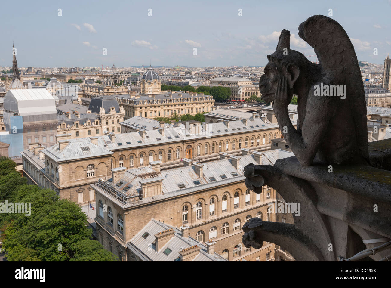 Gothic chimera on Paris' Notre Dame cathedral looks over the city Stock ...