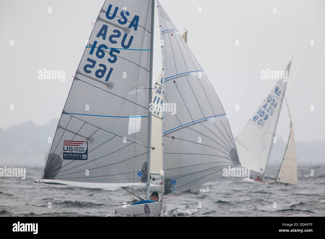 A 2.4 meter racing sailboat competing at a sailing championships in ...