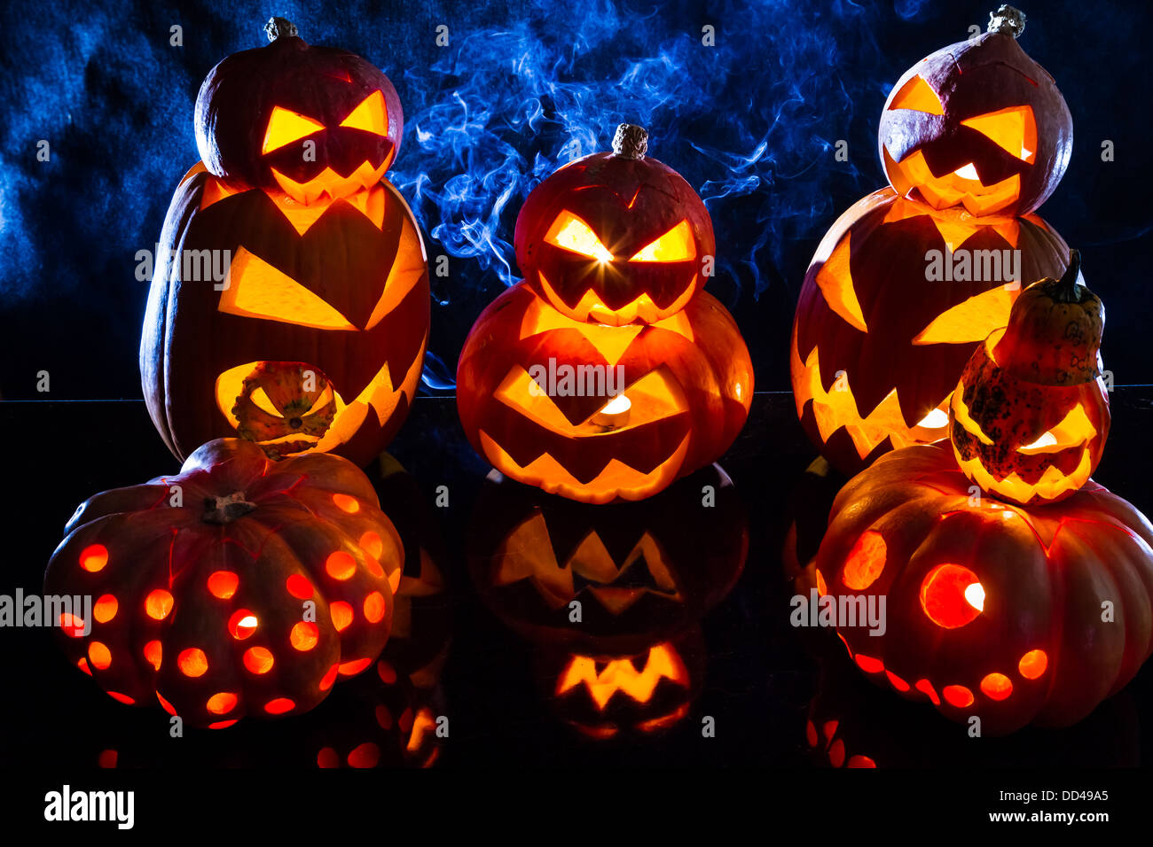 Group strange halloween pumpkins on black background with smoke Stock ...