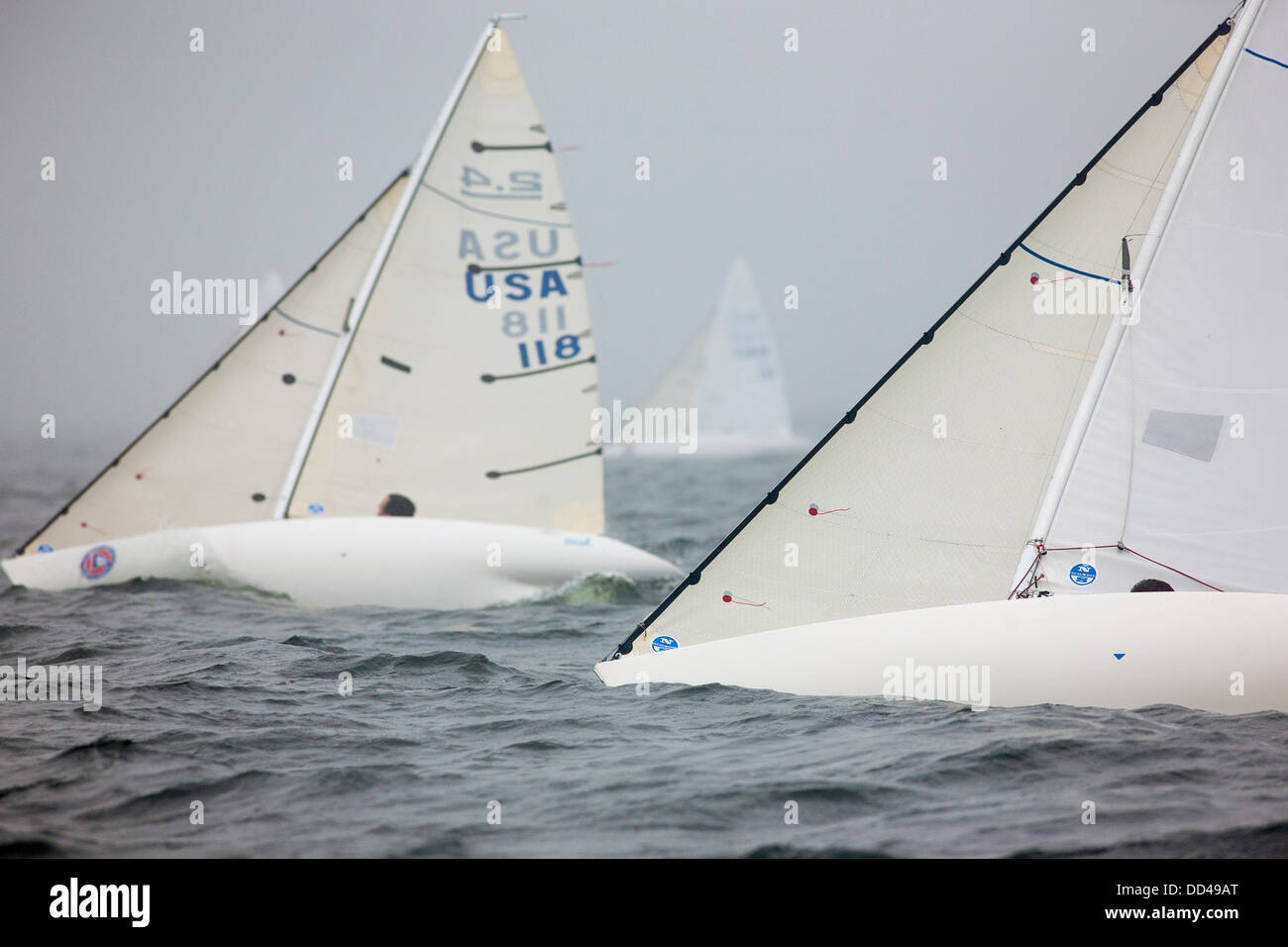 Two 2.4 meter racing sailboat competing at a sailing championships in ...