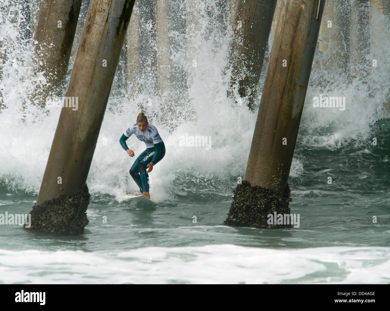 Female surfer competing in the US Open of Surfing competition Stock ...