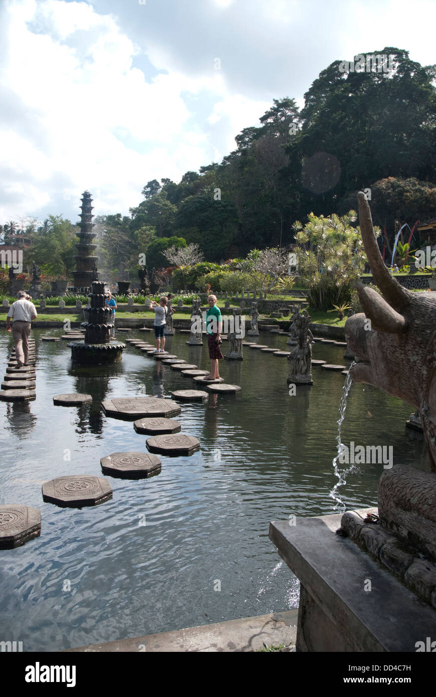 some water artifacts and statue in the water palace of Tirtagangga in ...