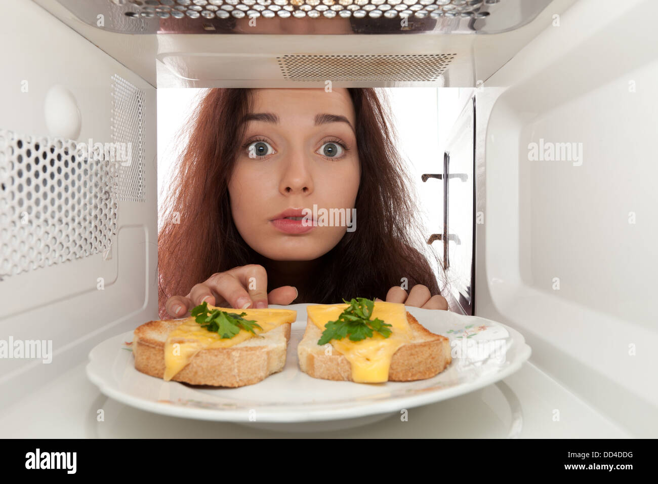 Attractive girl open microwave hi-res stock photography and images - Alamy