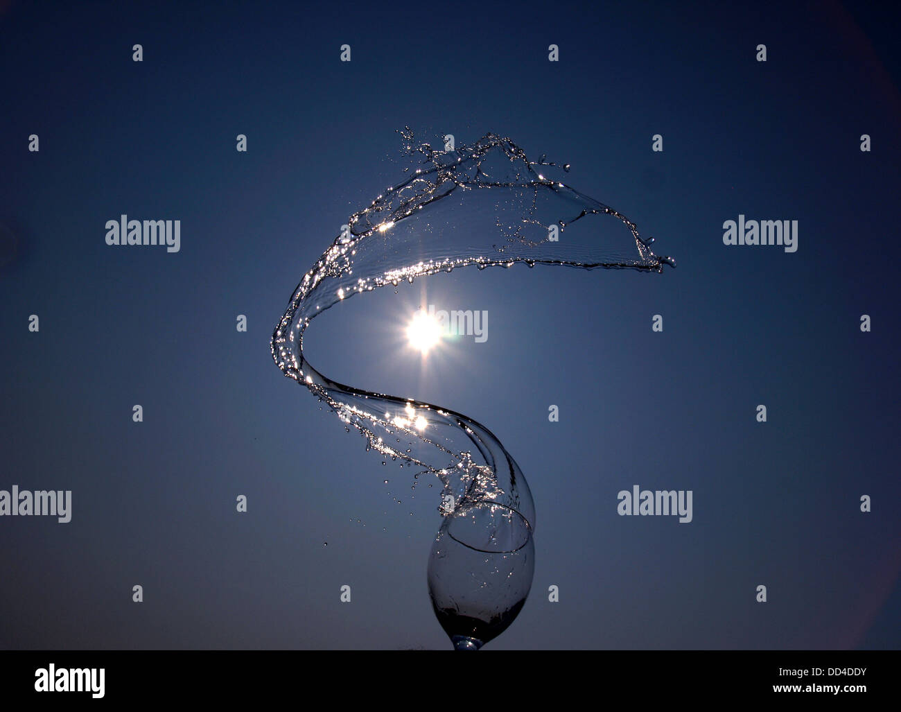 Water splashing from wine glass Stock Photo - Alamy