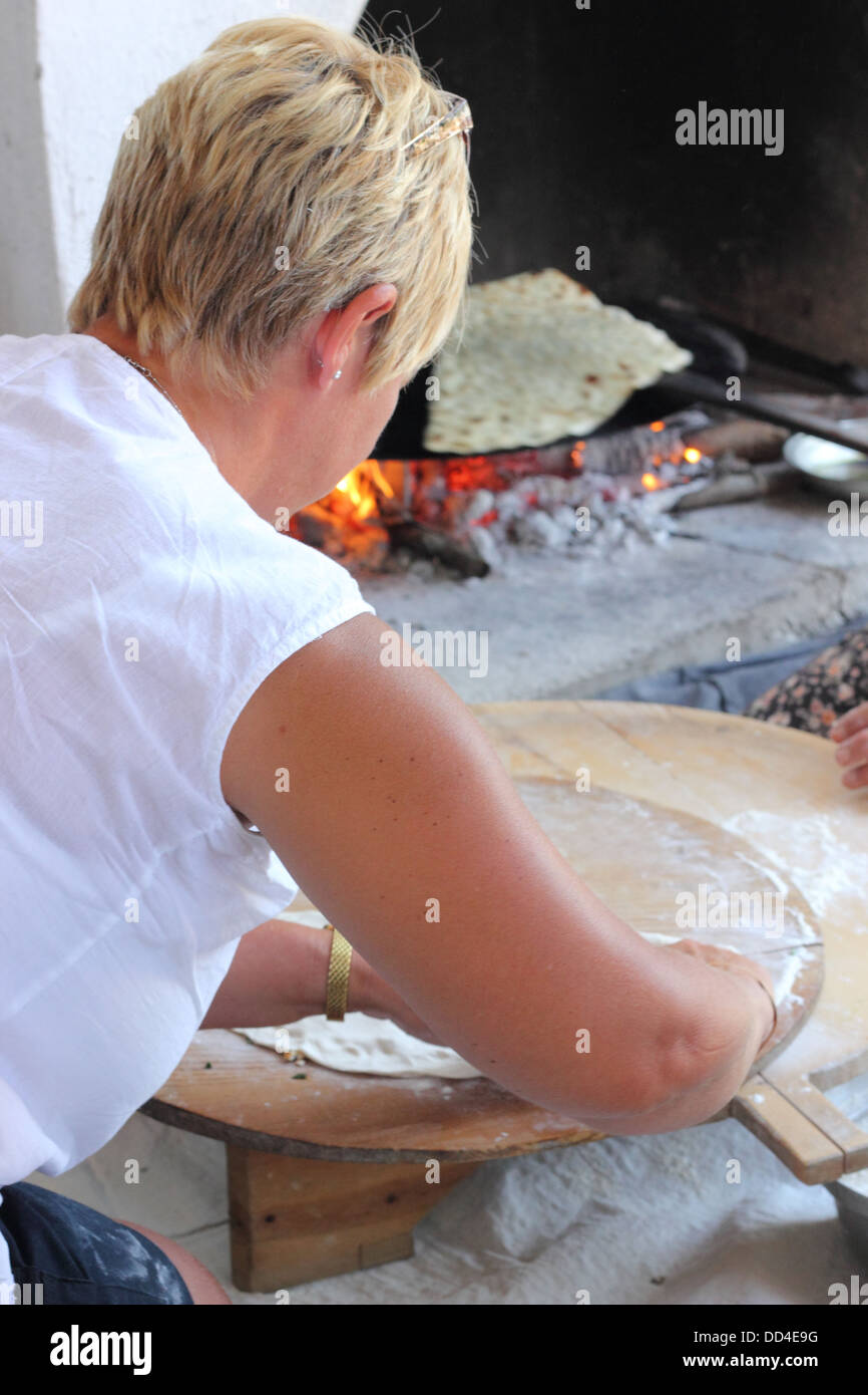 Teaching an english lady the traditional making of Turkish bread Stock ...