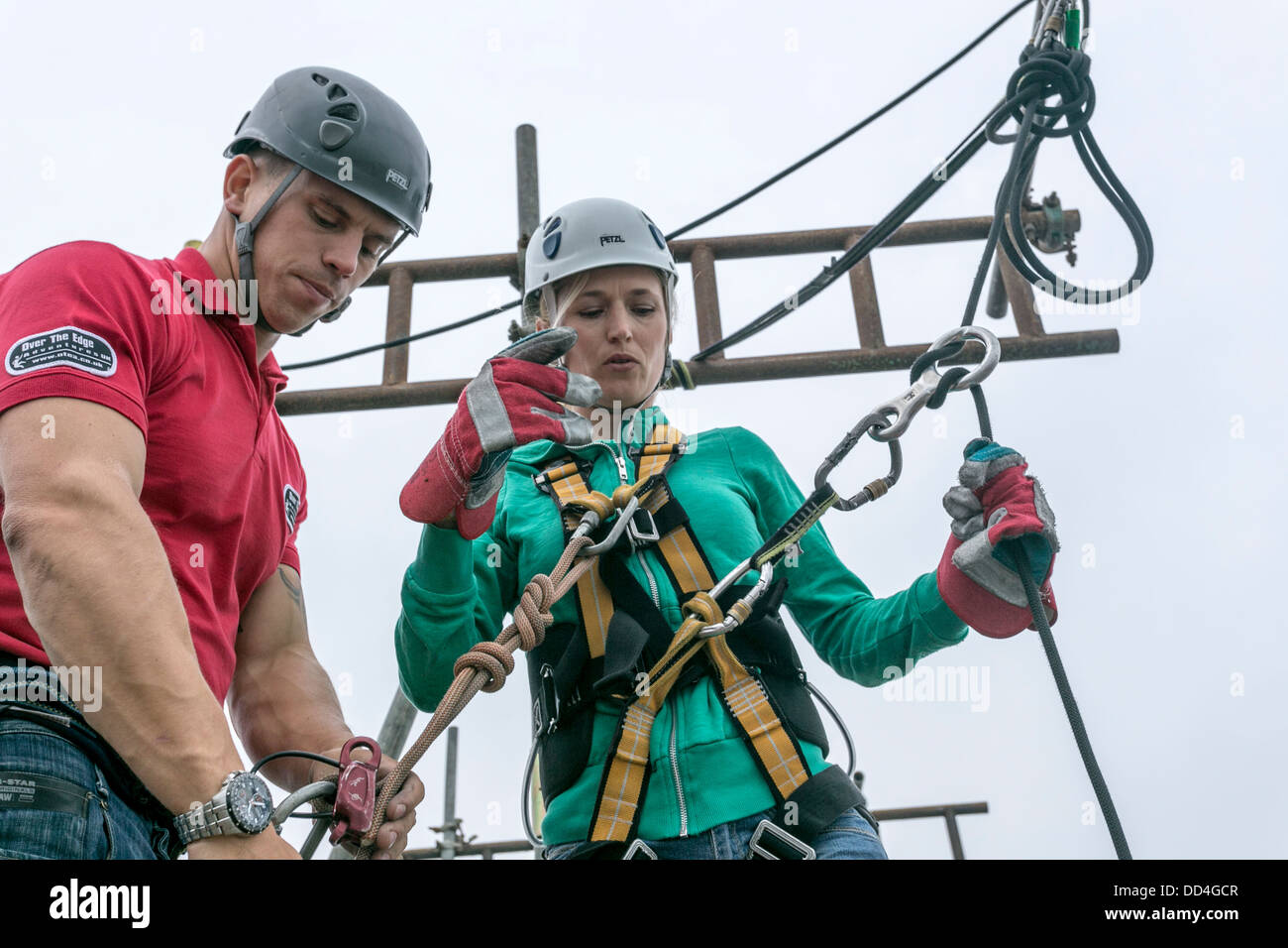 People Abseiling From a tower block for charity Stock Photo - Alamy