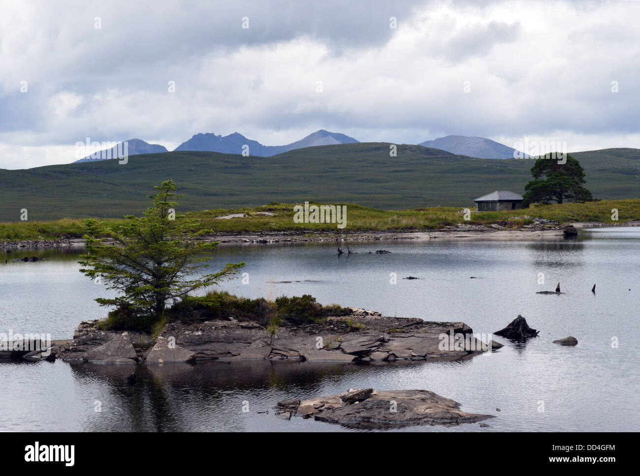The boat house on Home Loch with the Scottish Mountain An Teallach (a ...