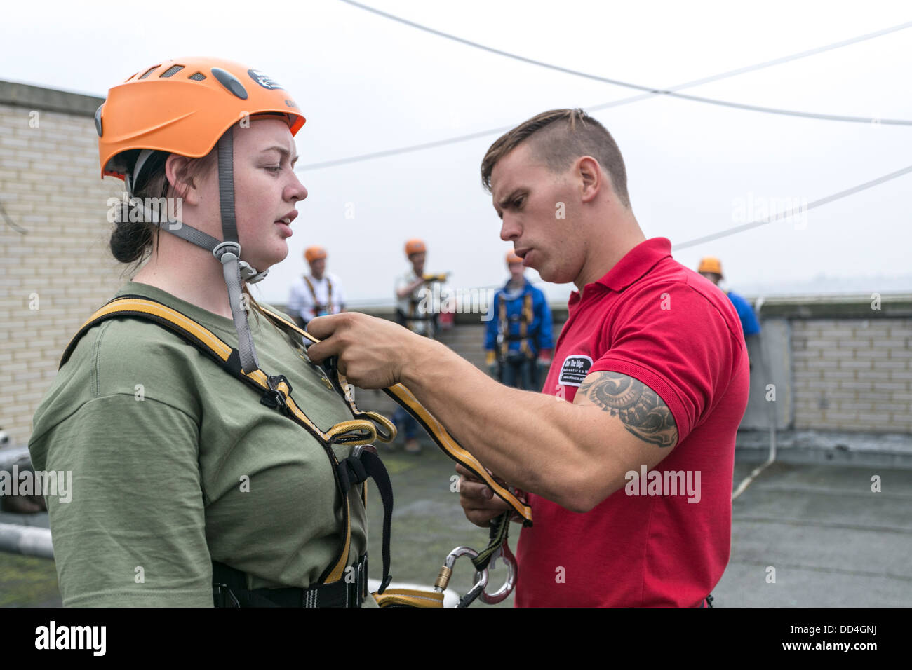 People Abseiling from a tower block for charity Stock Photo - Alamy