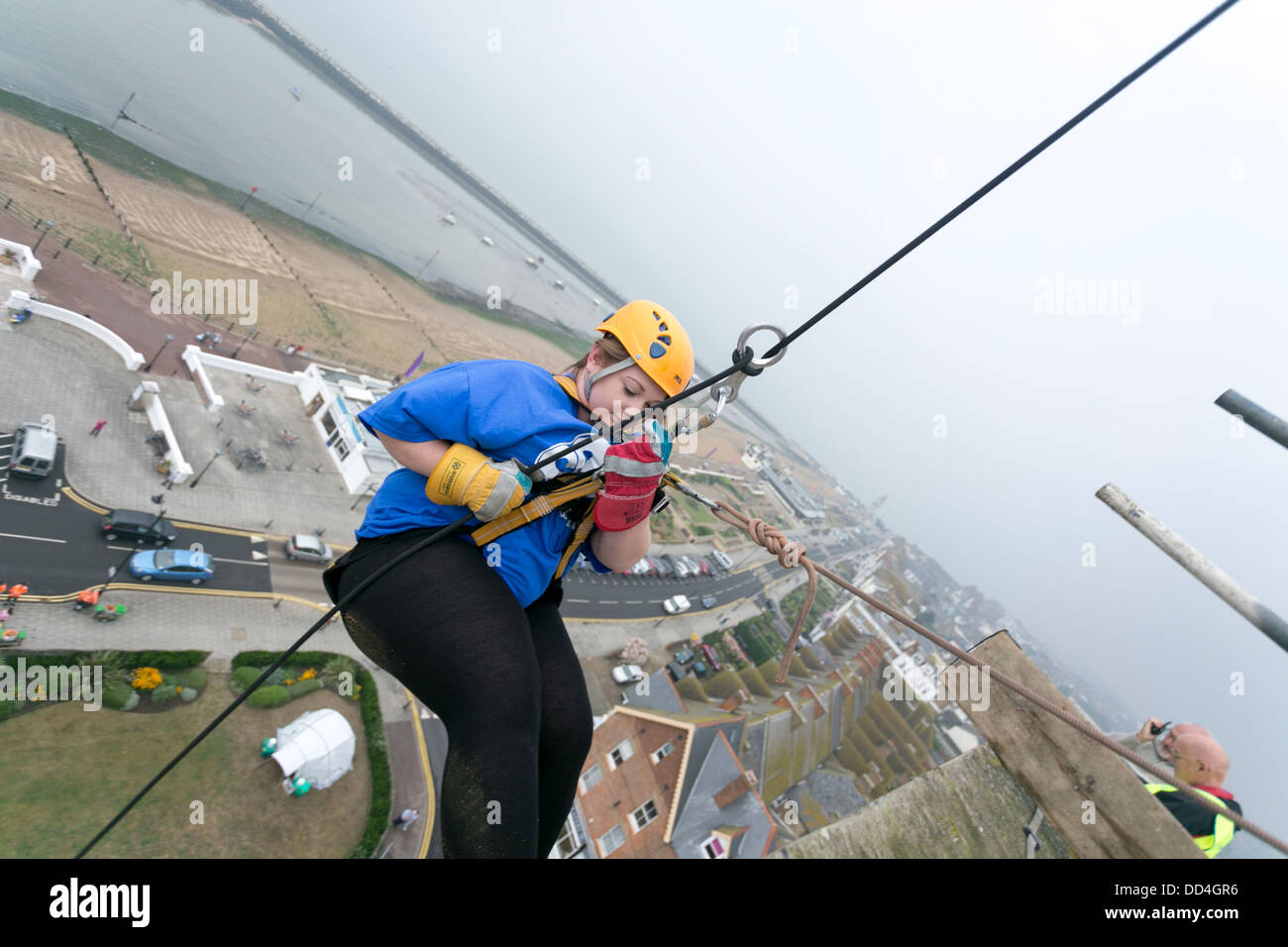 People Abseiling from a tower block for charity Stock Photo - Alamy