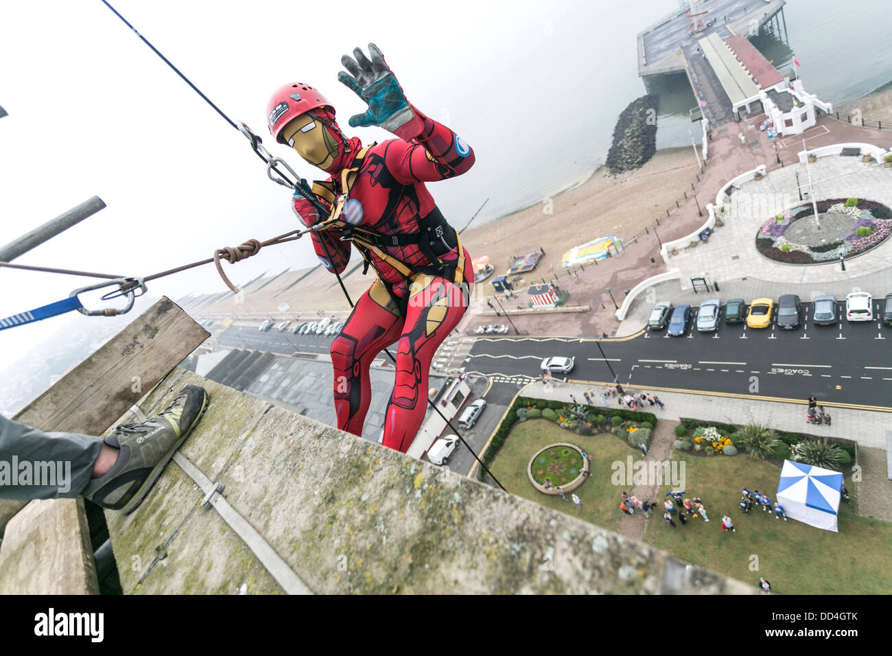People Abseiling from a tower block for charity Stock Photo - Alamy