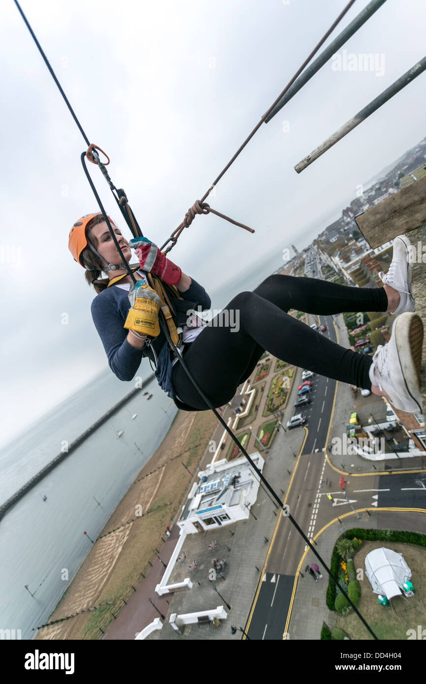 People Abseiling from a tower block for charity Stock Photo - Alamy