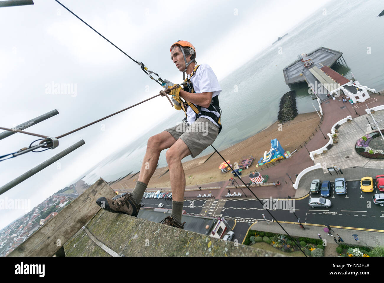 People Abseiling from a tower block for charity Stock Photo - Alamy