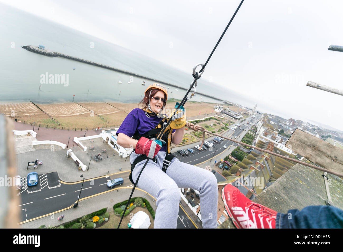 People Abseiling from a tower block for charity Stock Photo - Alamy