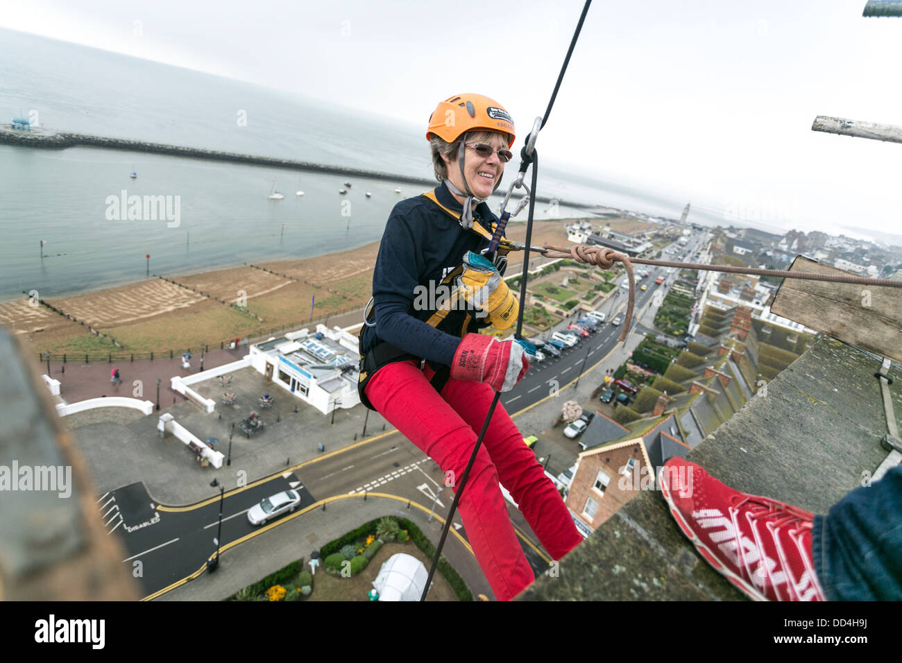 People Abseiling from a tower block for charity Stock Photo - Alamy
