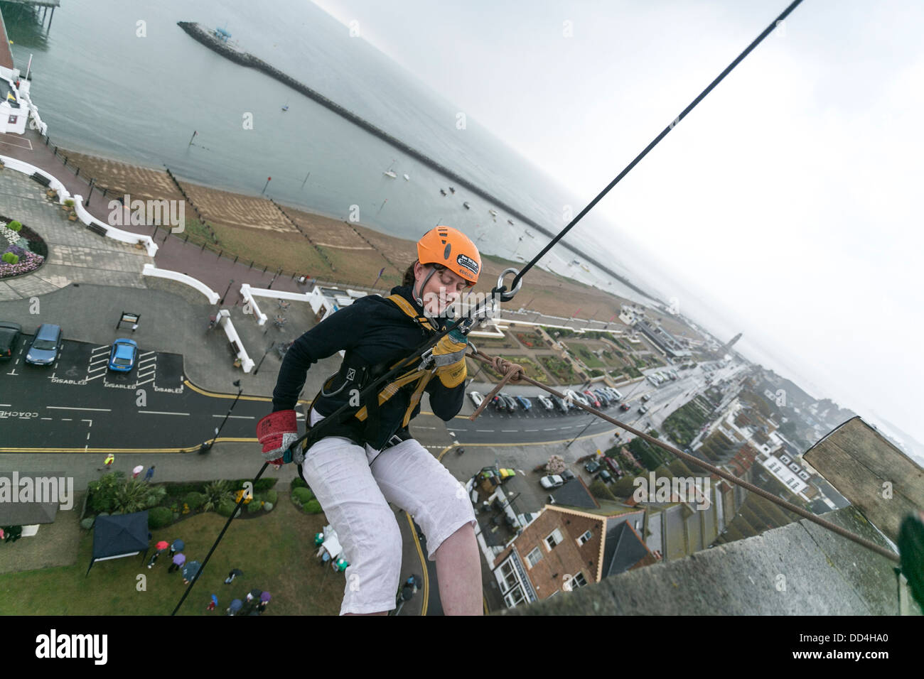 People Abseiling from a tower block for charity Stock Photo - Alamy