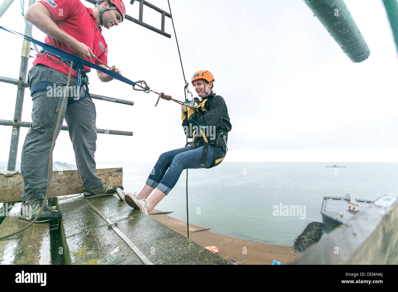 People Abseiling from a tower block for charity Stock Photo - Alamy