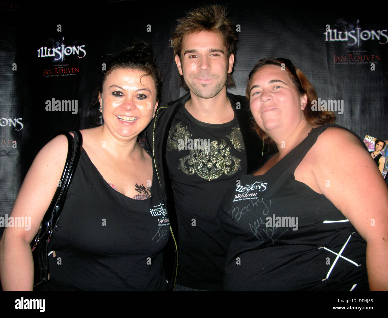 German illusionist Jan Rouven poses with two fans Trina Wolfenbarger ...