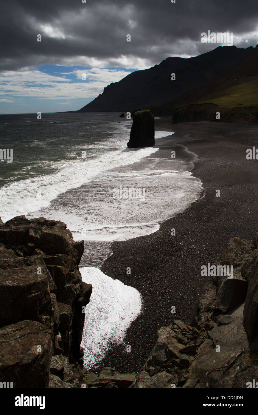 Sea Stack on Black Beach Stock Photo - Alamy