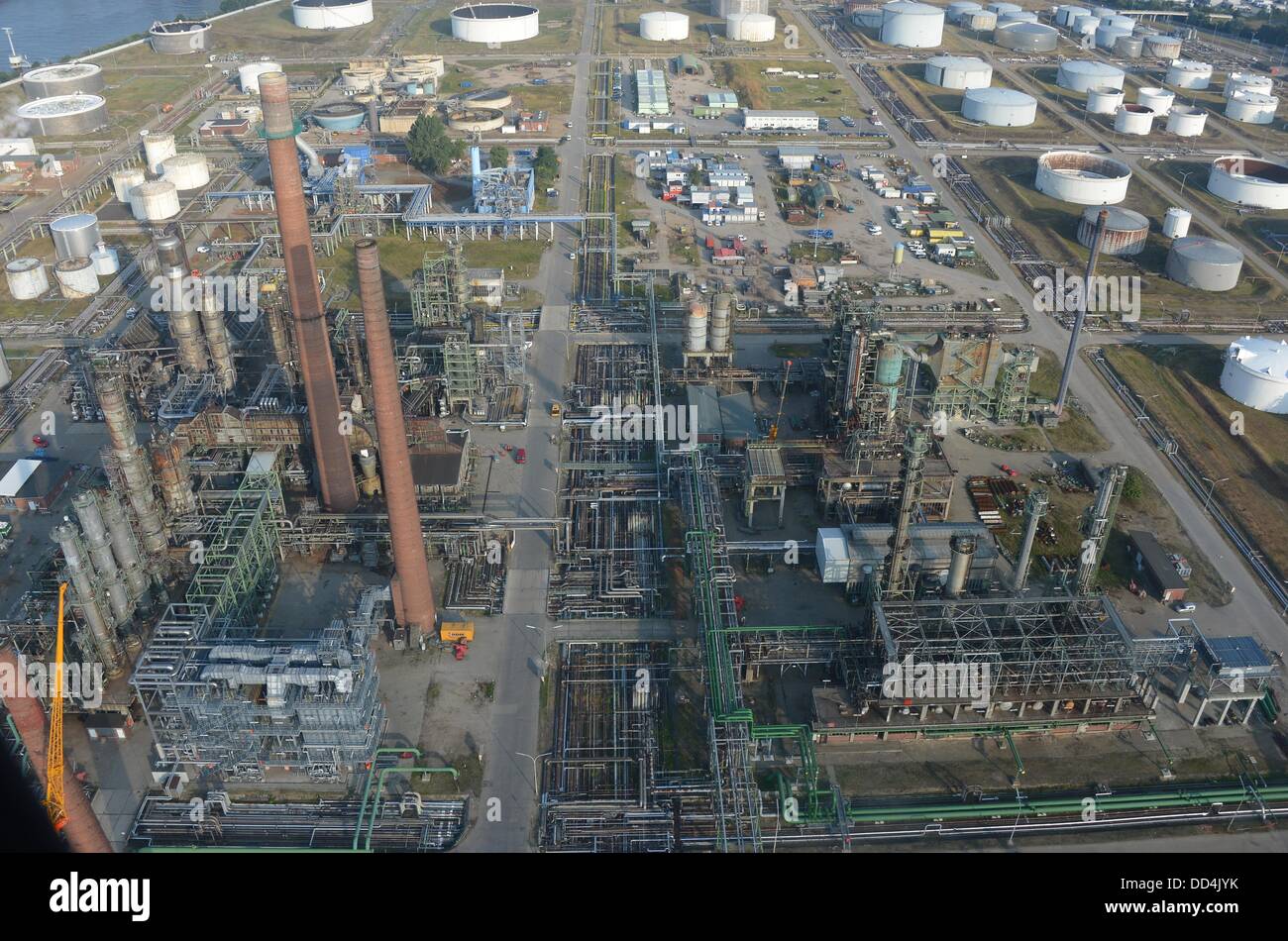 A refinery of Shell with giant oil tanks located on the premise is ...