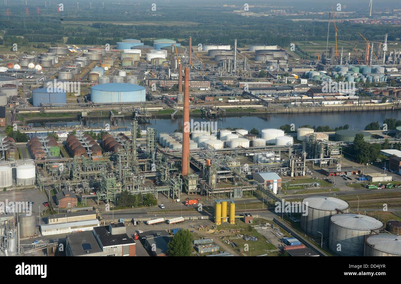 A refinery of Shell with giant oil tanks located on the premise is ...