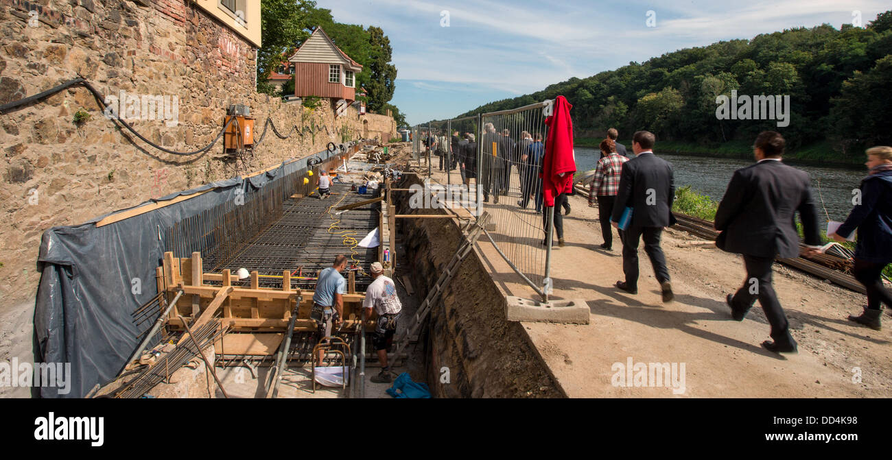 Workers work on the construction site of a flood protection system on ...