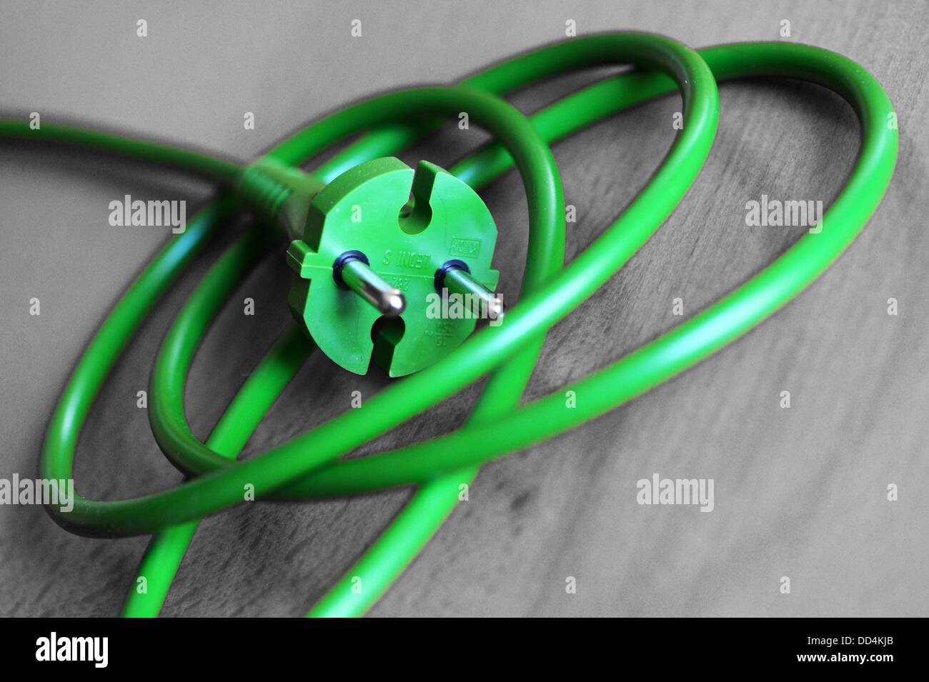 ILLUSTRATION - A green plug with power cable is pictured in Berlin ...