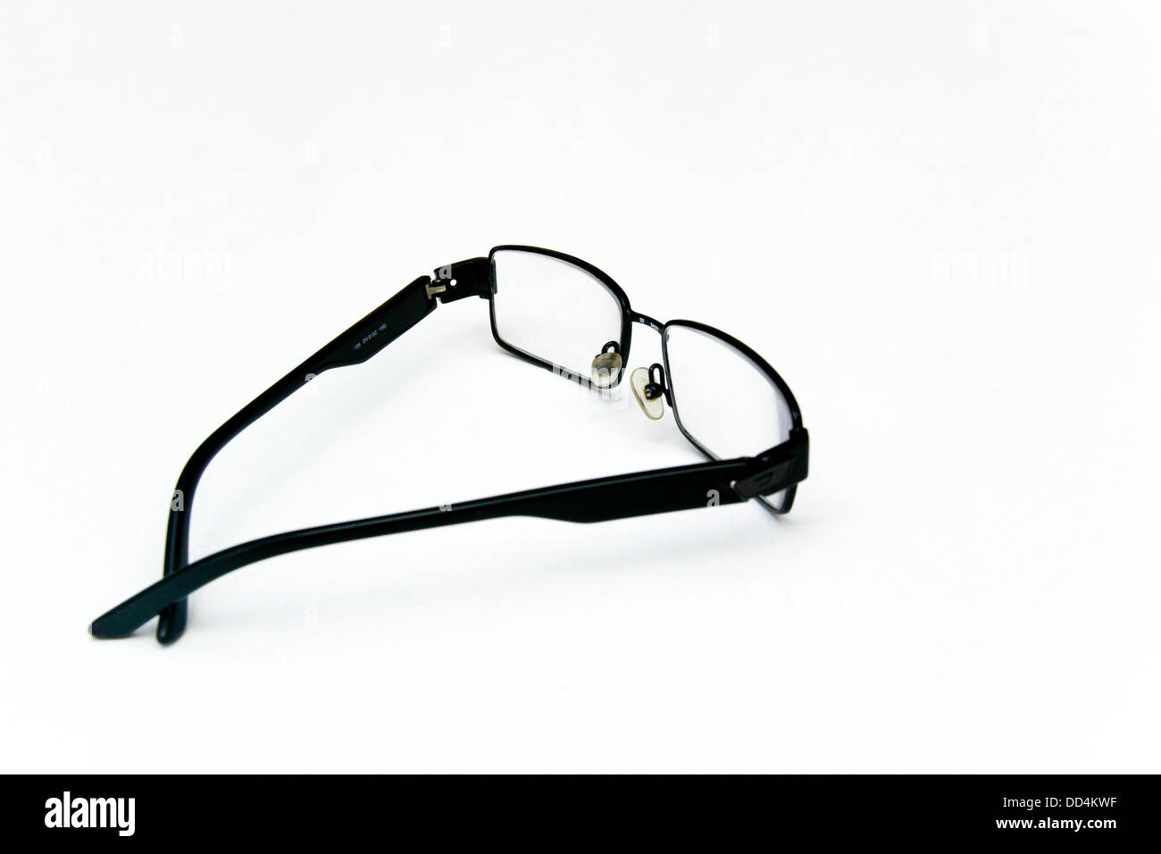 Gents spectacles on table top Stock Photo - Alamy