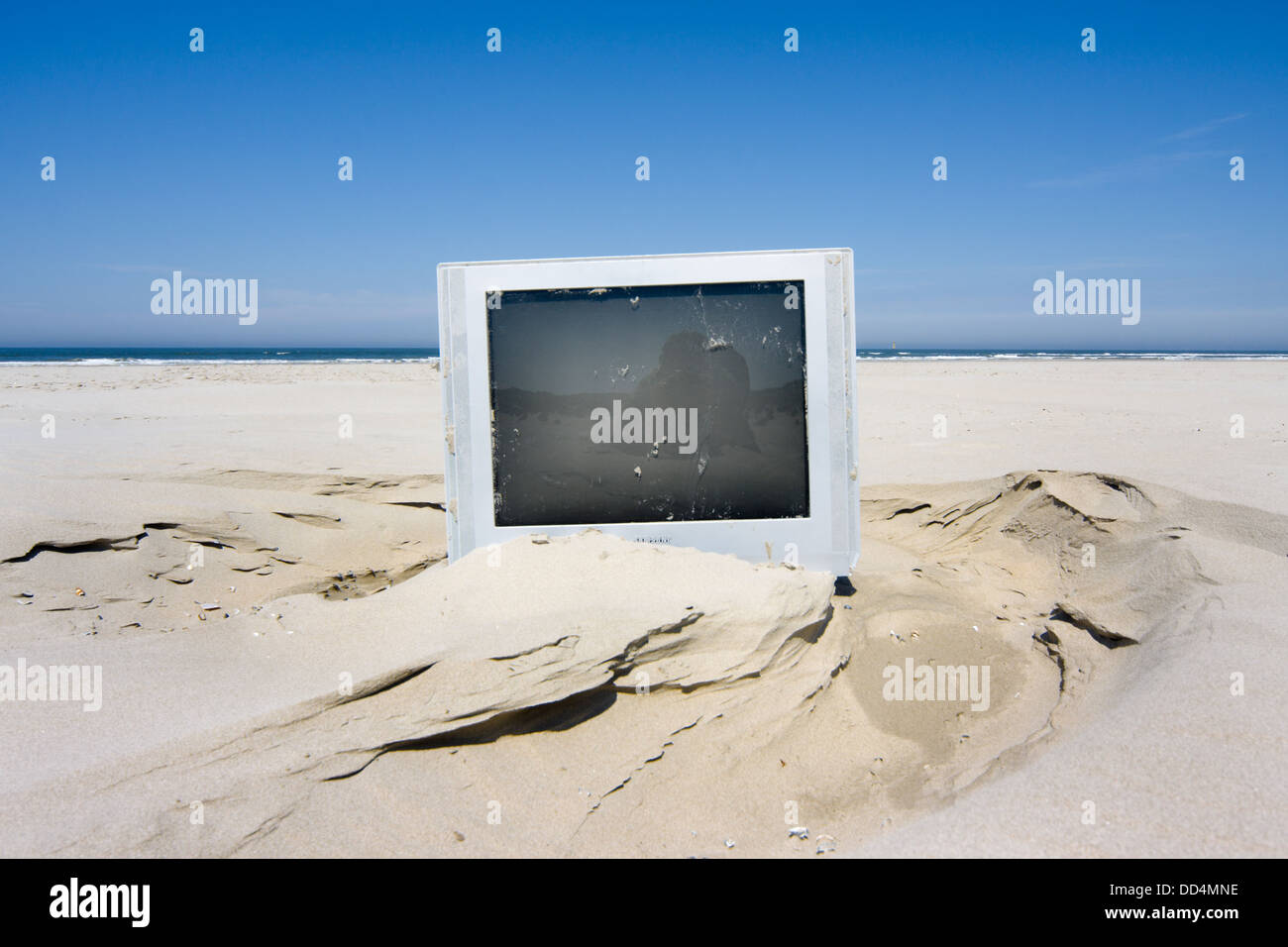Garbage washed ashore; an old television on a beach Stock Photo - Alamy