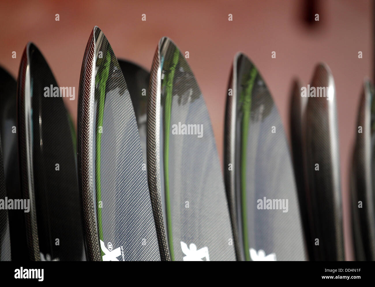 Extra light racing paddles are lined up at the regatta course in ...