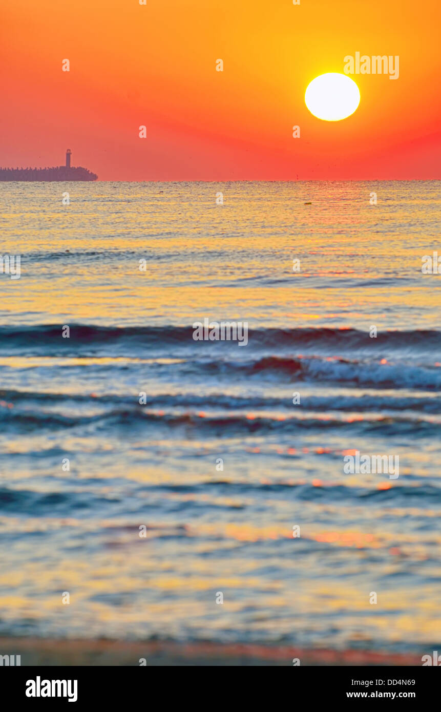 Beach and sea sunset in summer time Stock Photo - Alamy