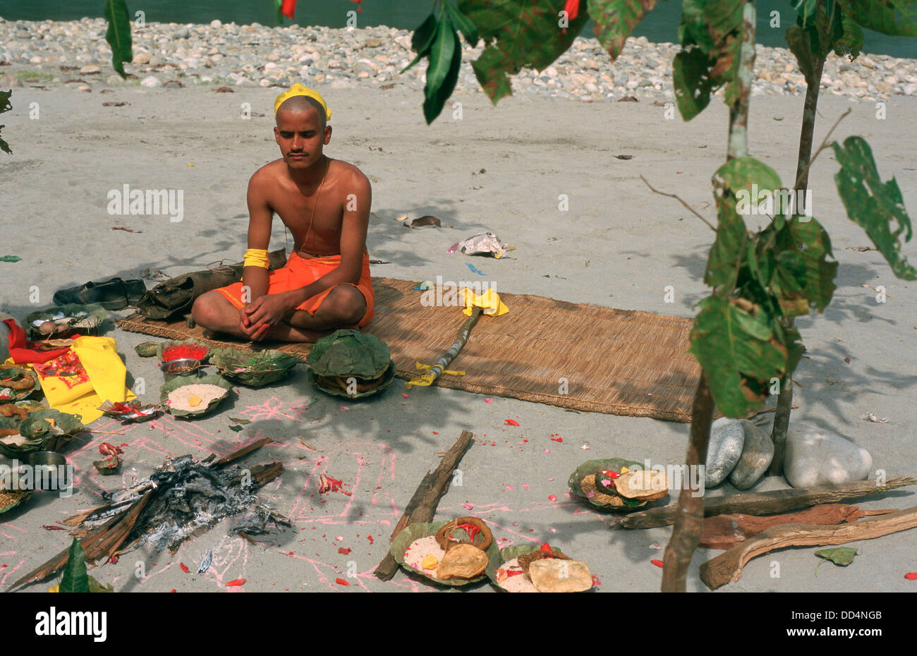 Hindu man performing a funeral ritual on a beach ( Nepal Stock Photo ...