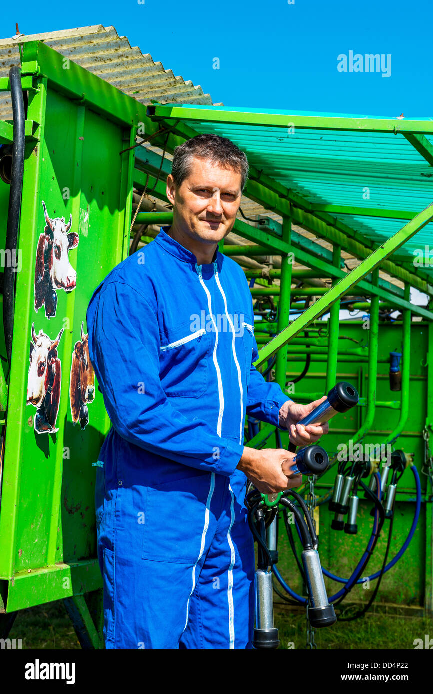 Farmer milking cows machine hi-res stock photography and images - Alamy