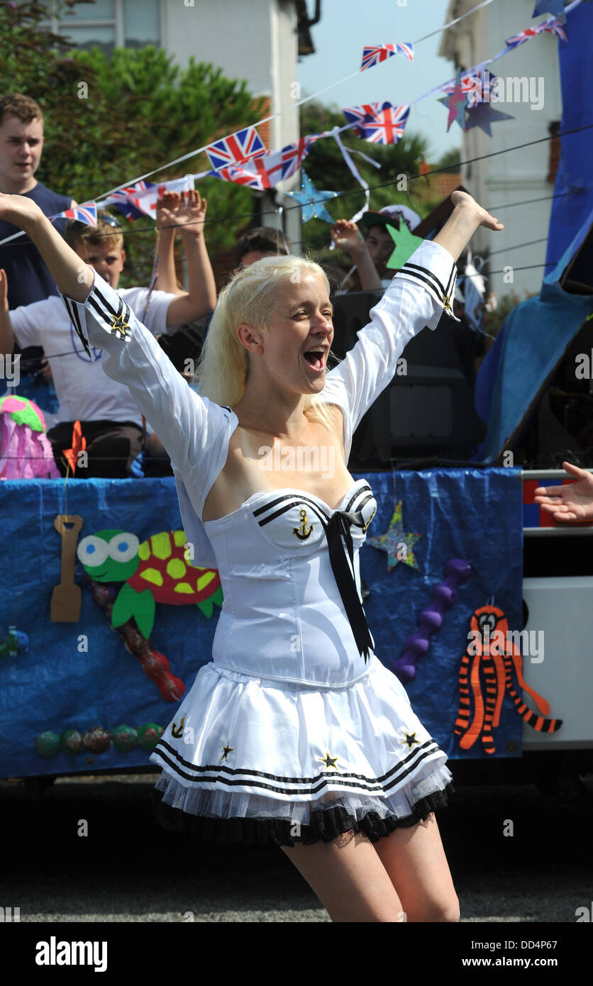 Young woman in costume enjoys the hot weather as they take part in the ...