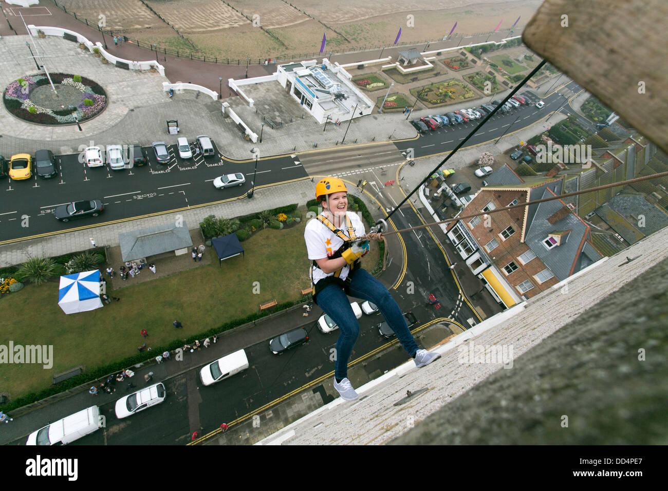 People Abseiling from a tower block for charity Stock Photo - Alamy