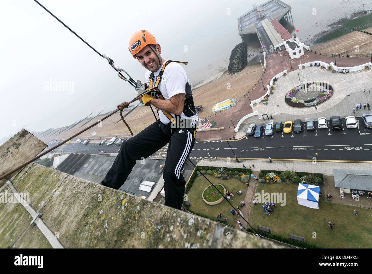 People Abseiling from a tower block for charity Stock Photo - Alamy