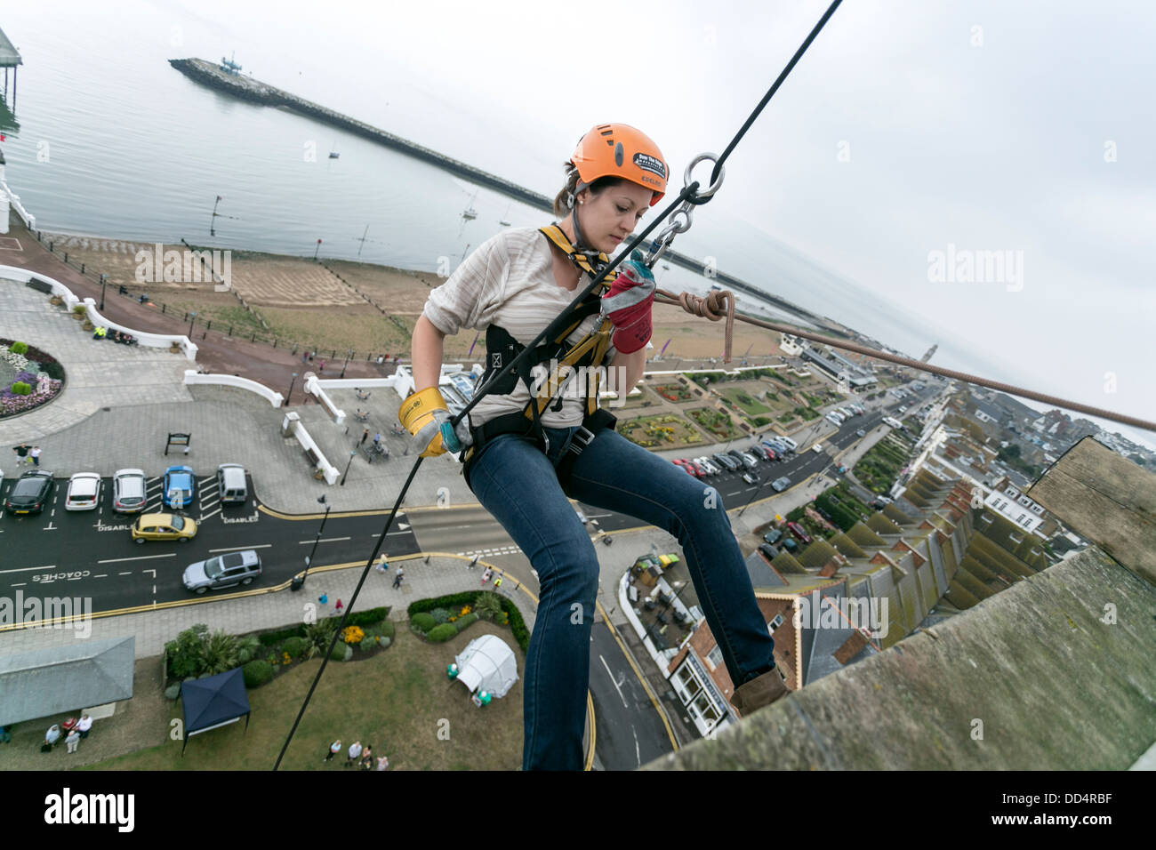 People Abseiling from a tower block for charity Stock Photo - Alamy