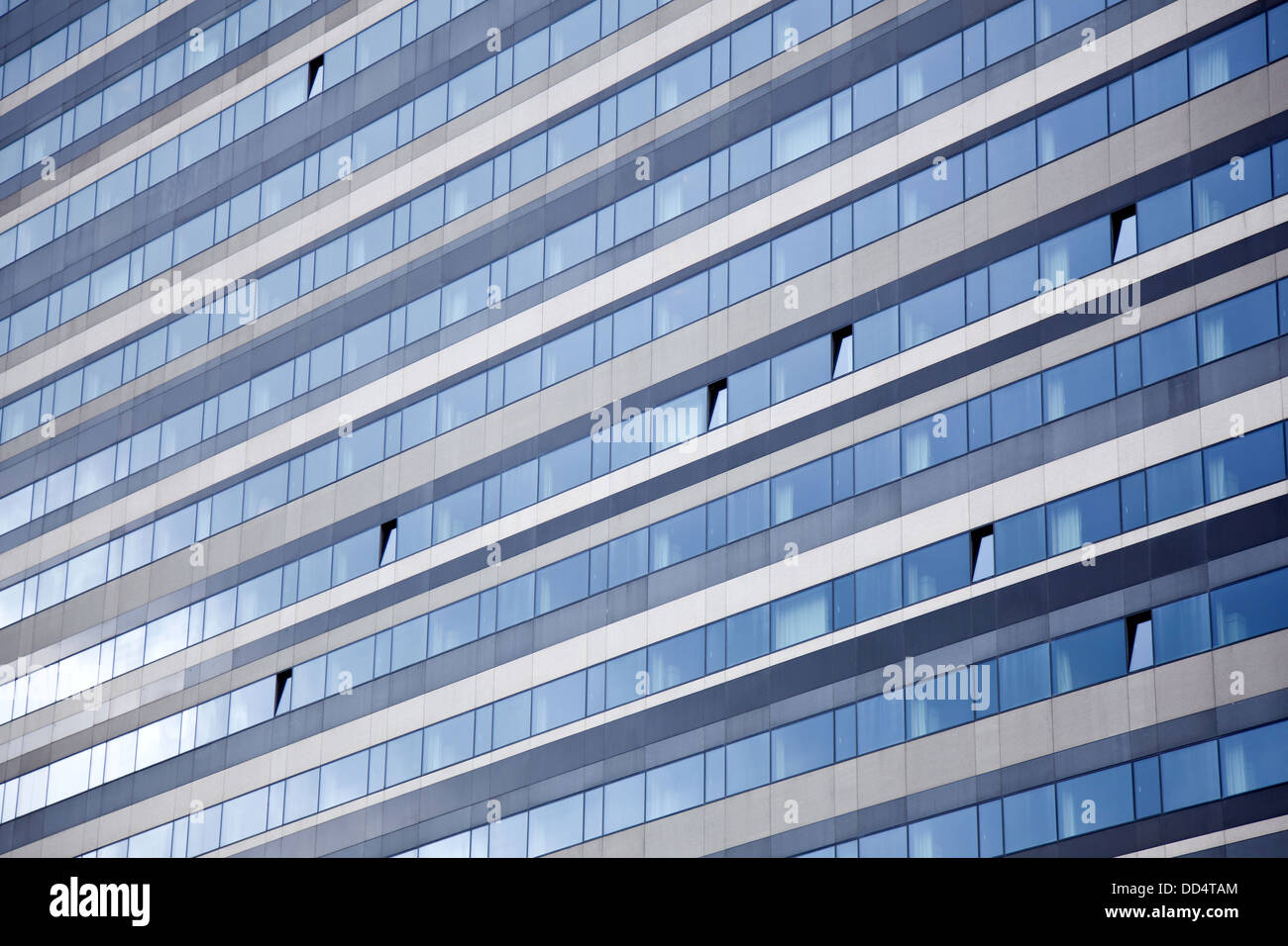 modern facade with diagonal lines reflecting sky Stock Photo - Alamy