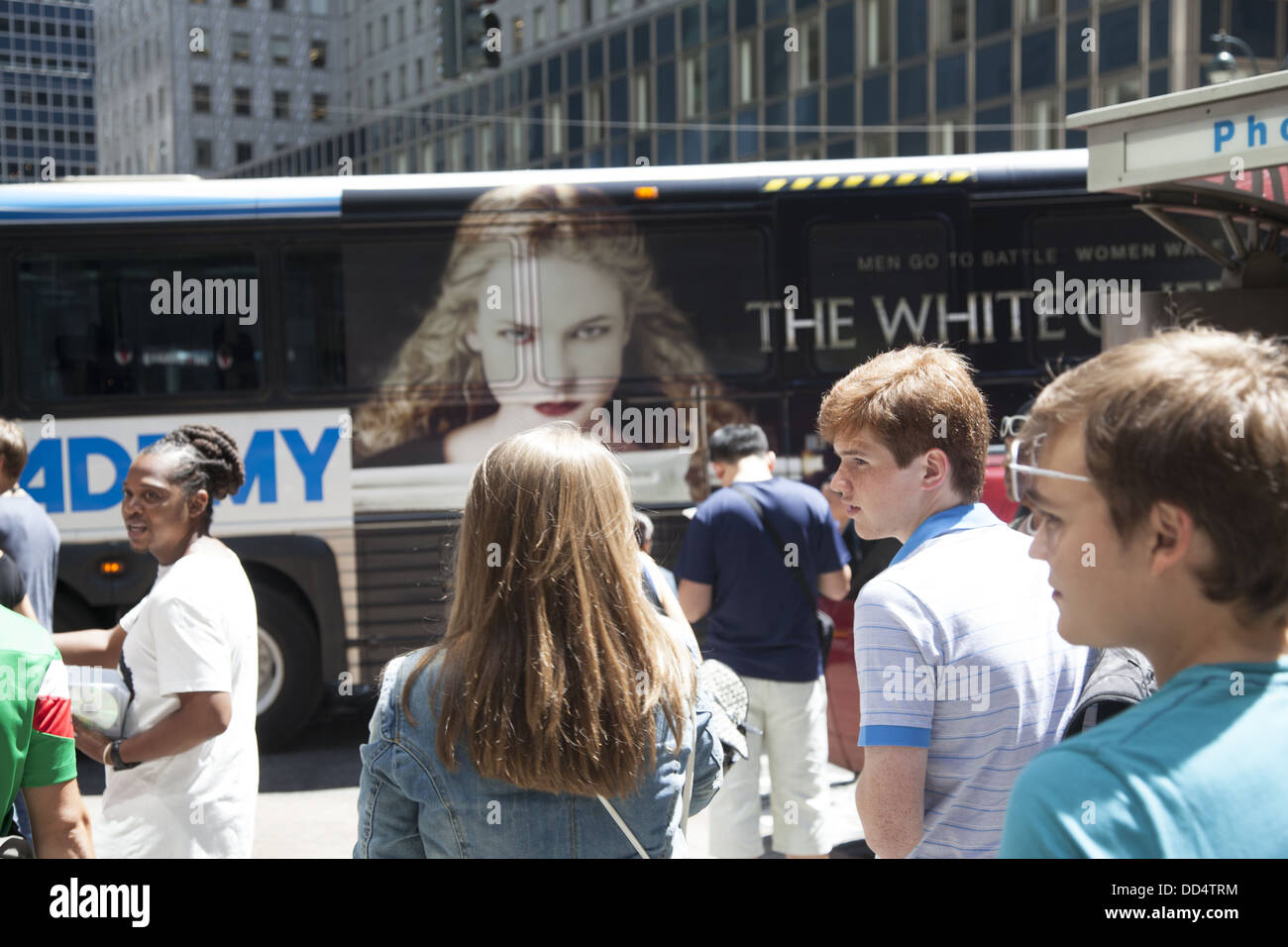 Kids and a bus advertisement, 5th Ave., New York City Stock Photo - Alamy