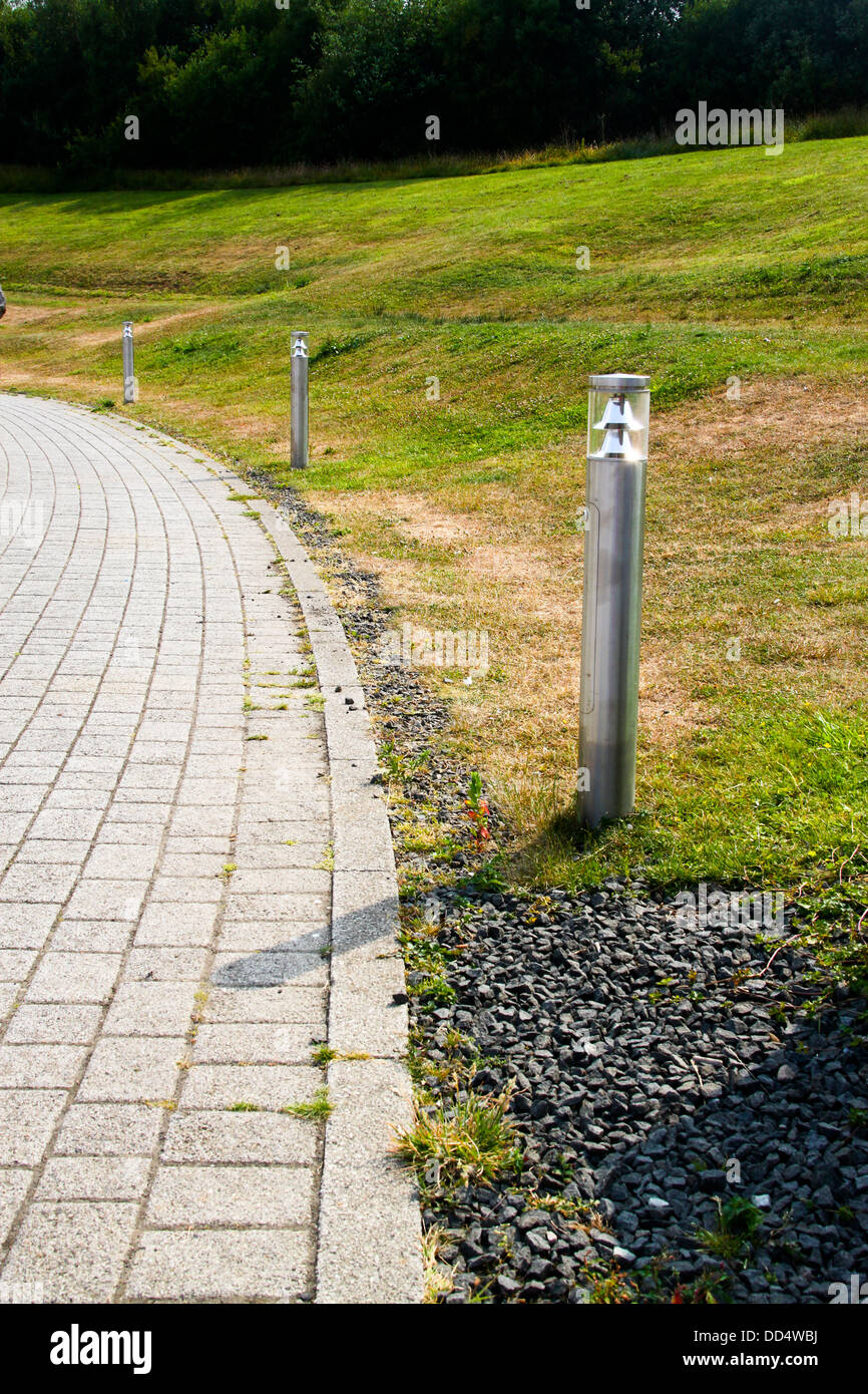 Stainless steel pillar style walkway lights Stock Photo - Alamy