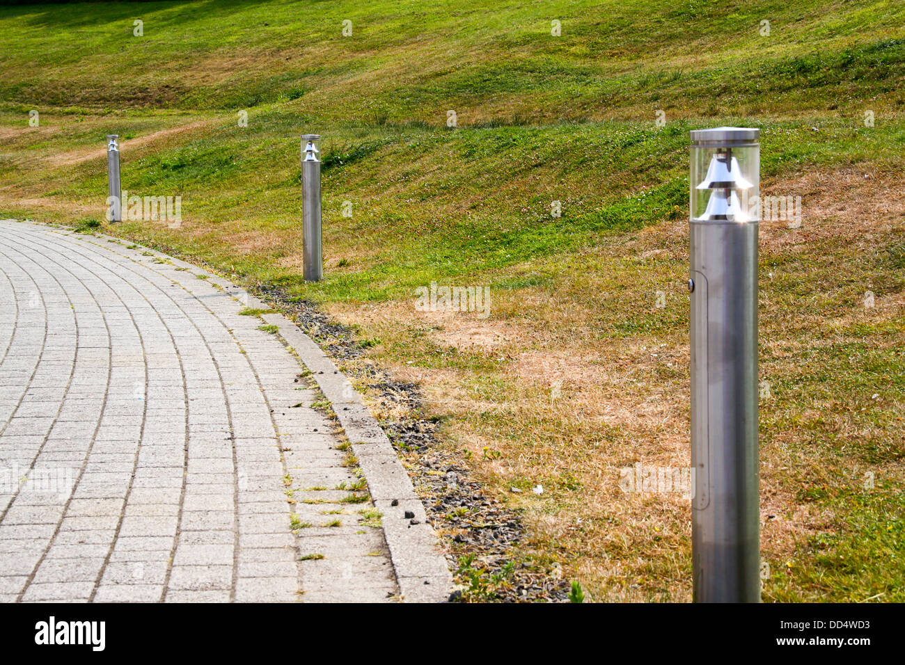 Stainless steel pillar style walkway lights Stock Photo - Alamy