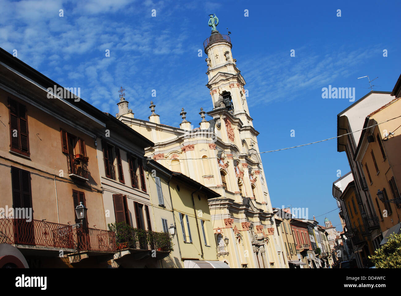 Street view and baroque church on blue sky, Crema town, Lombardy, Italy ...