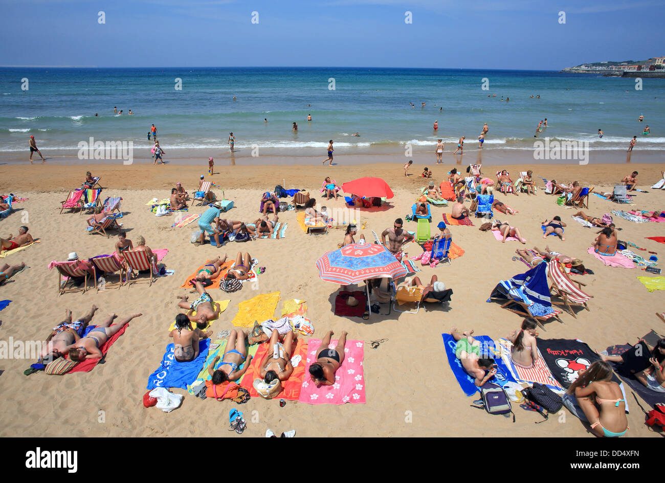 Crowded city beach during a hot summer day in Gijon, north Spain Stock ...