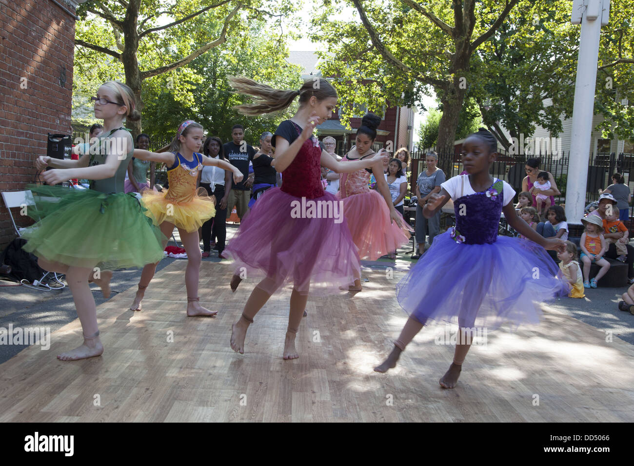 Young dancers perform at a dance festival in their local playground in ...