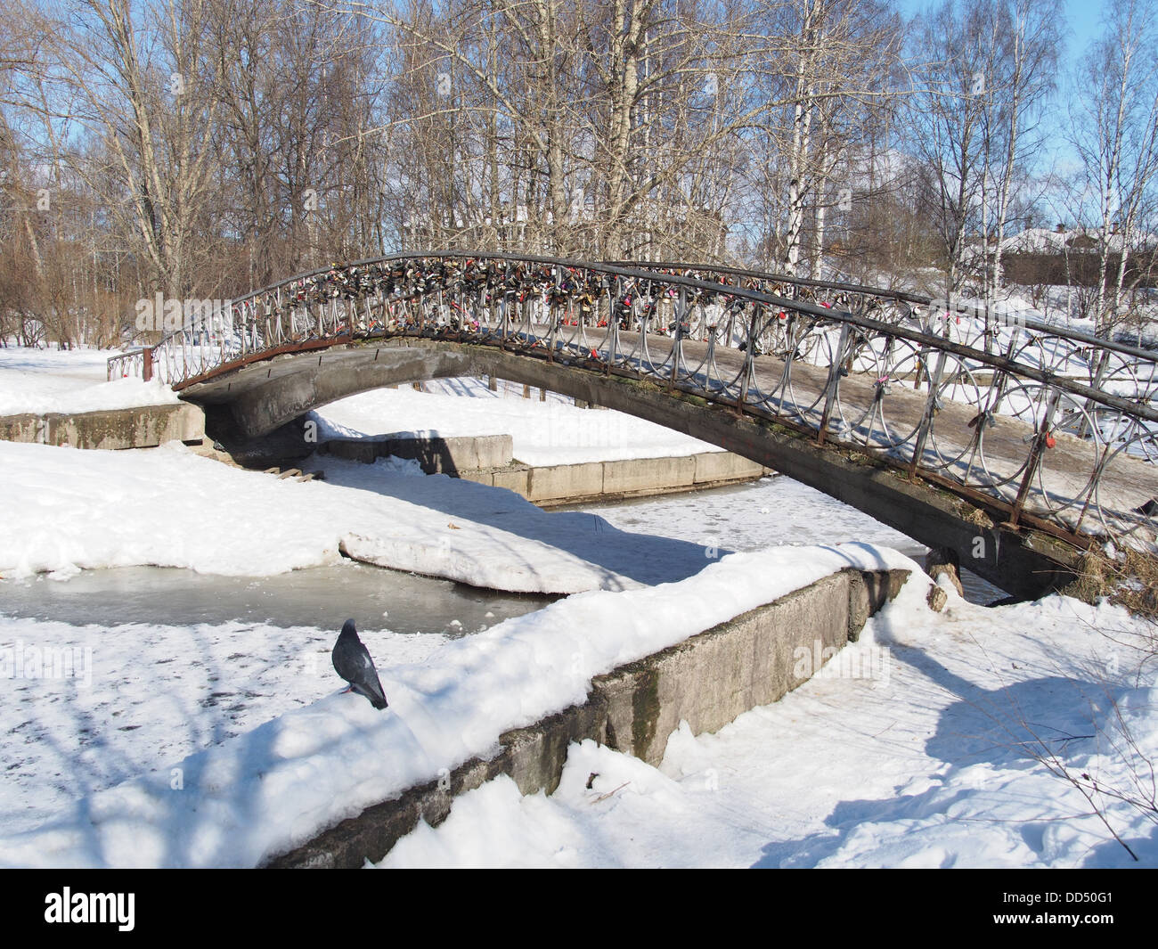 The bridge through the river in the winter Stock Photo - Alamy