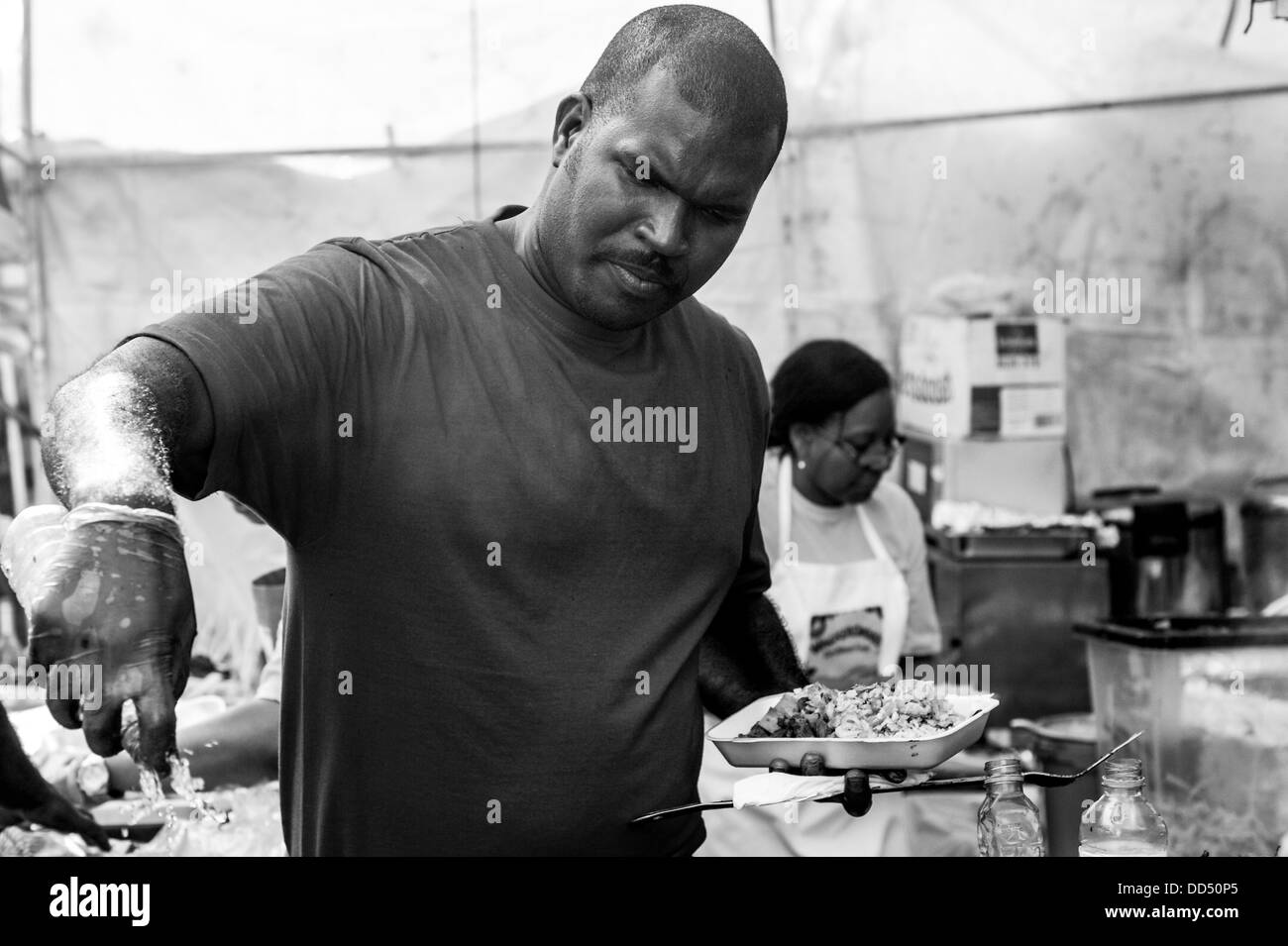 Man cooking food on Black and White Stock Photos & Images - Alamy