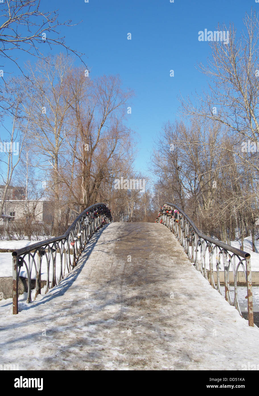 The bridge through the river in the winter Stock Photo - Alamy