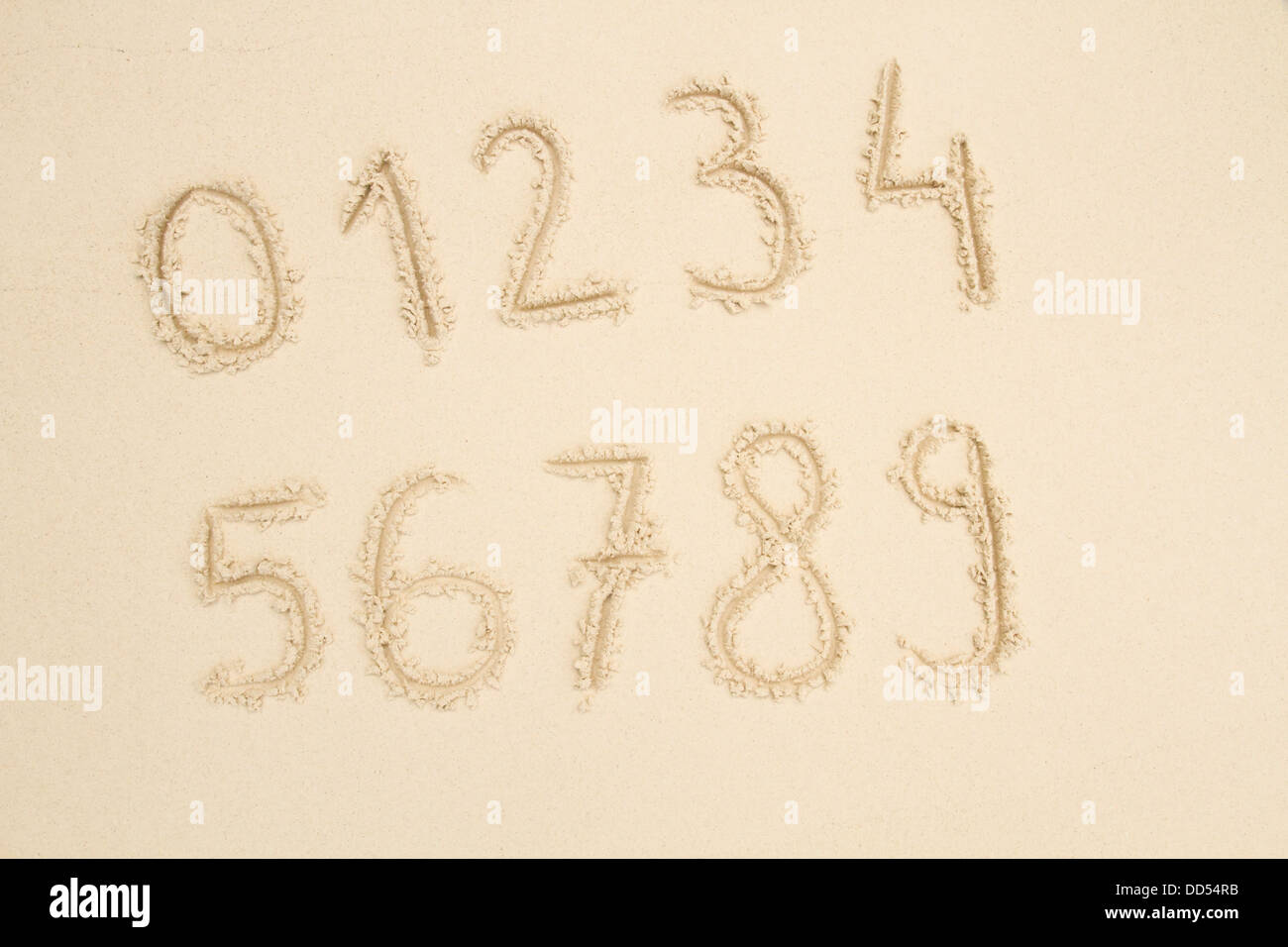 alphabet in sand Stock Photo - Alamy